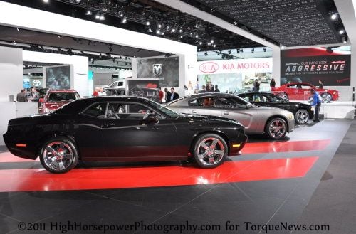 A look at several vehicles in the Dodge display at the 2011 Detroit ...